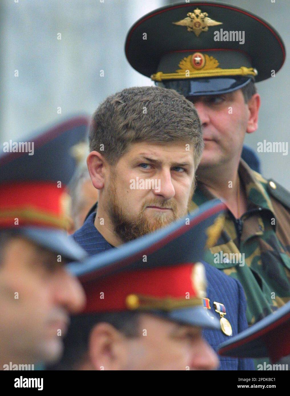 Chechnya's First Deputy Prime Minister Ramzan Kadyrov, center, stands ...