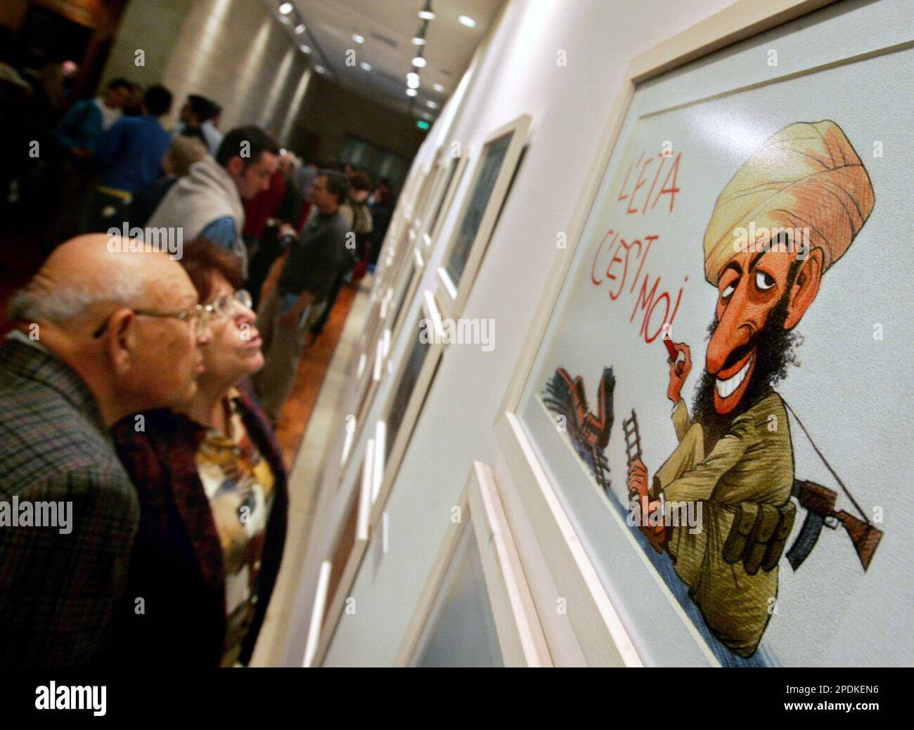 People view cartoons by Israeli political cartoonist Michel Kichka, one ...