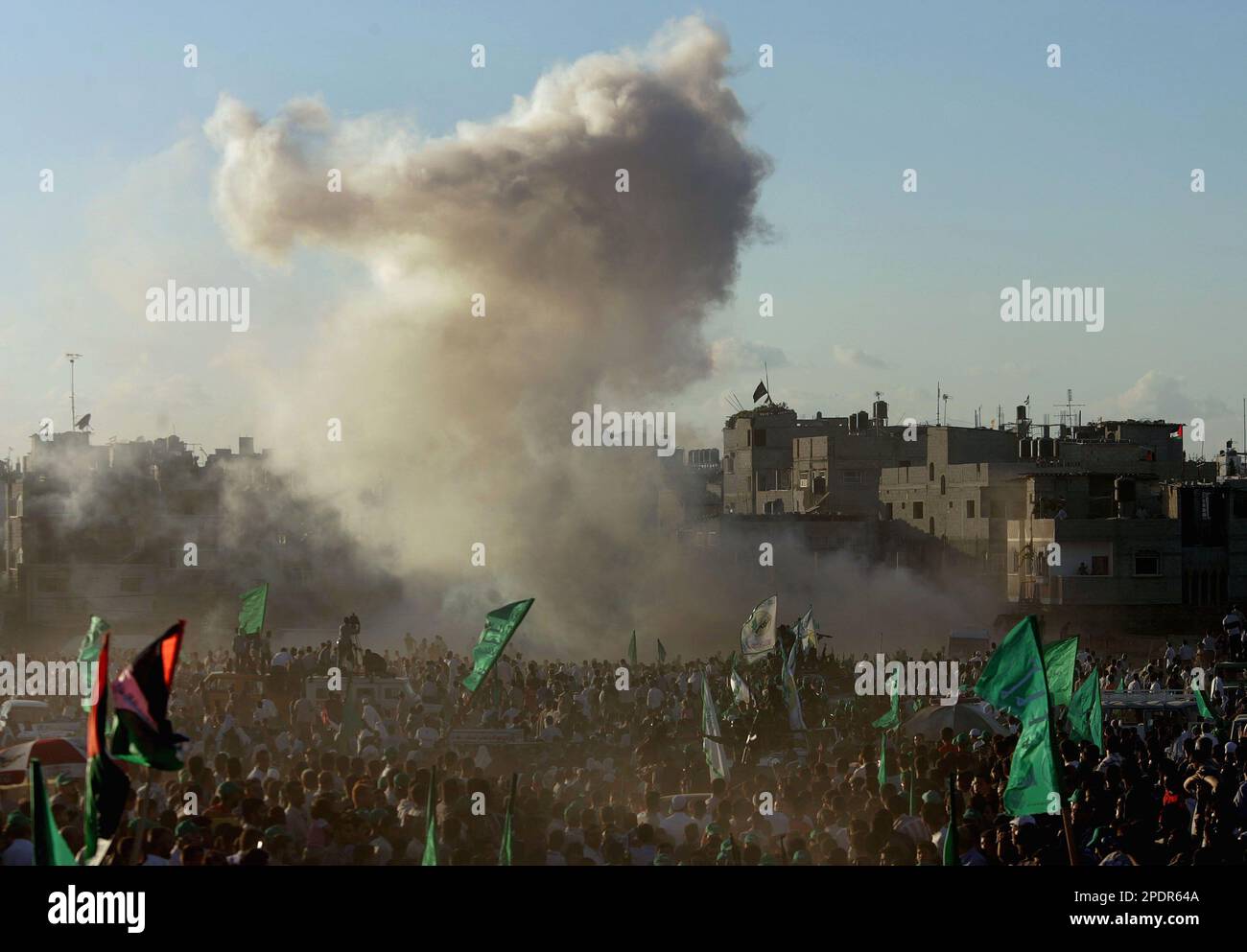 An explosion is seen during a demonstration by the Palestinian militant ...
