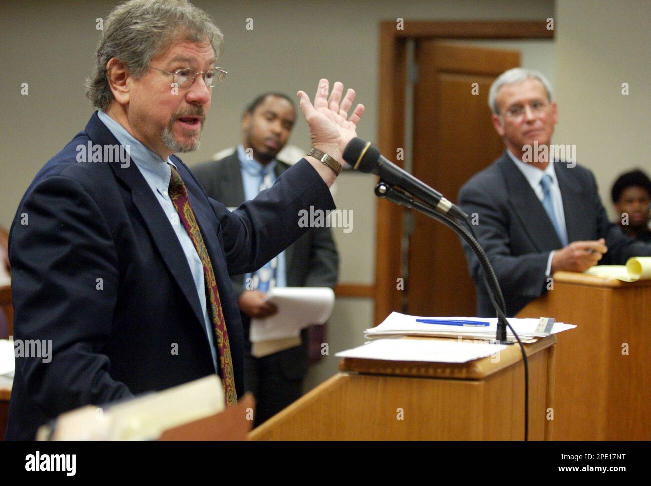 Assistant State Attorney Michael Von Zamft, left, gestures as defense ...