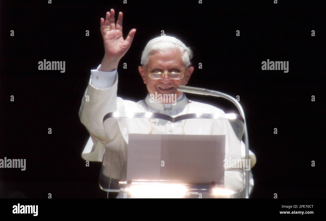 Pope Benedict XVI greets the faithful during his first appearance of ...