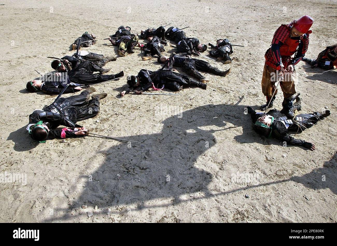 A Samurai warrior finishes by a stab during a reenactment of the age of ...
