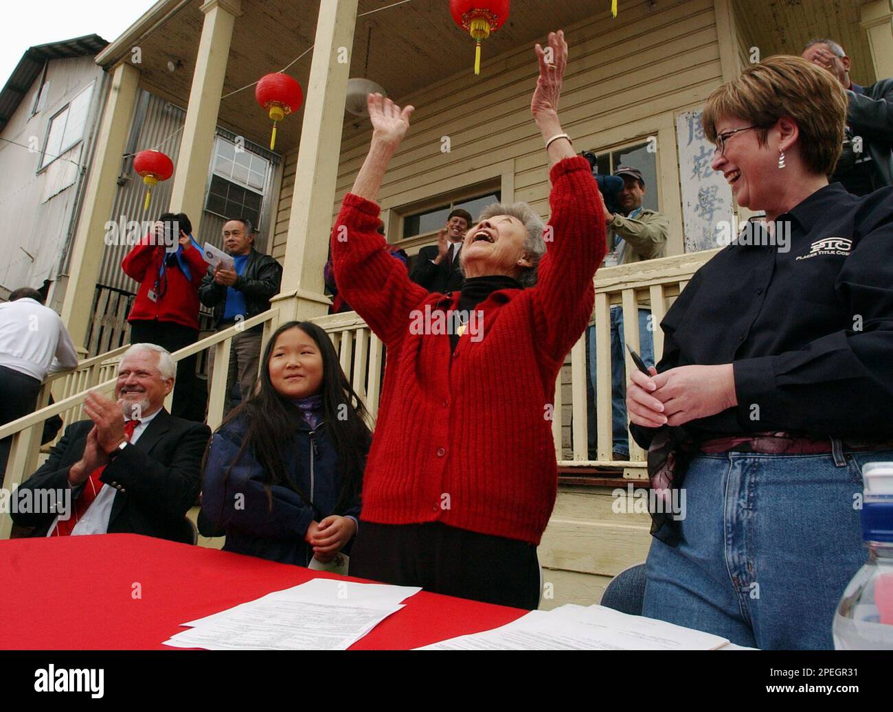 Connie King, second from right, raises her arms in celebration after ...