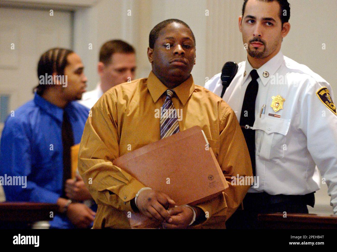 Marquis Nelson, center, and Joseph Cousin, left, both charged in ...