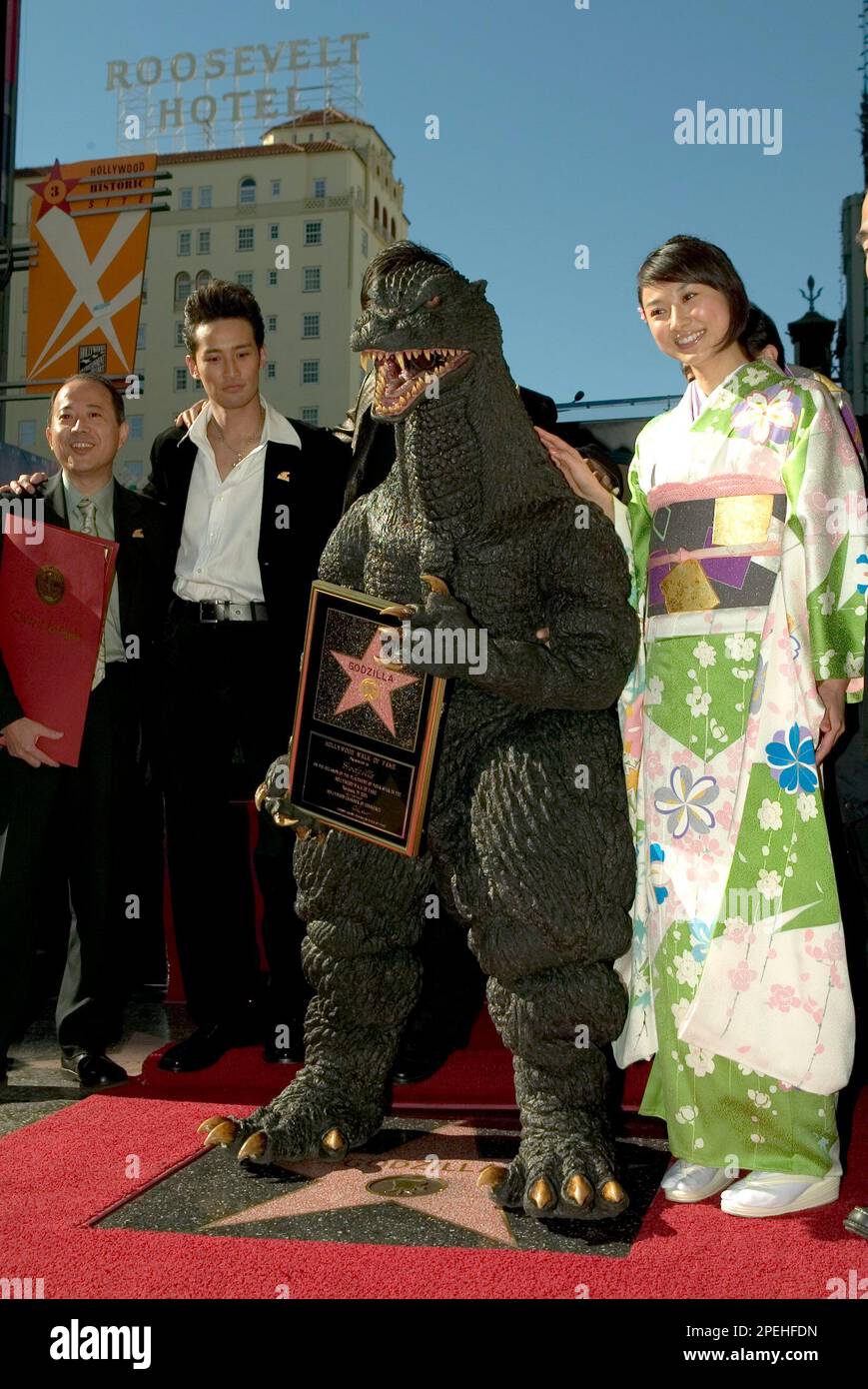 Film character 'Godzilla' poses with a Japanese film crew as the film ...