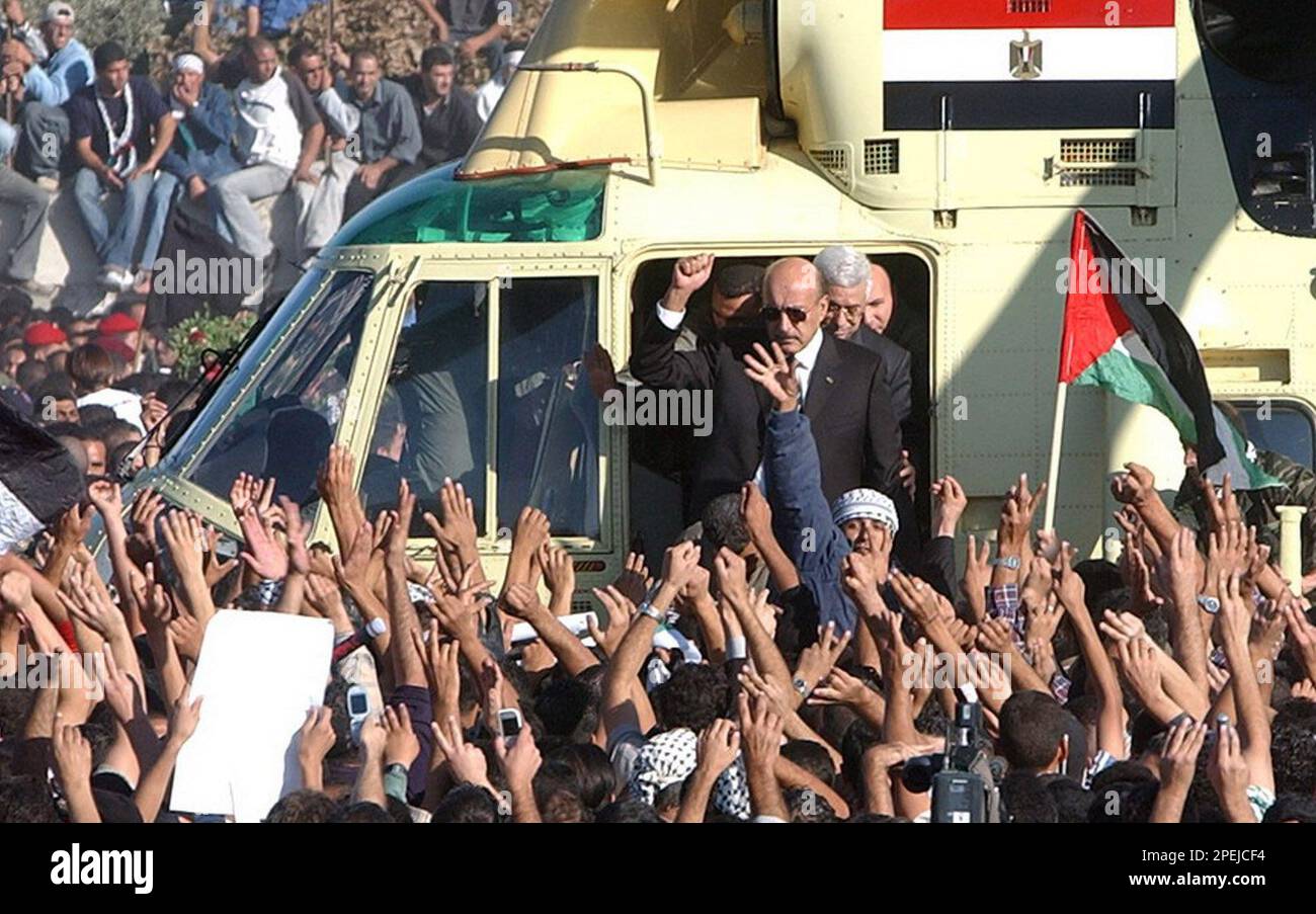 Egyptian Inteligence chief Omar Suleiman, front, waves as he is ...