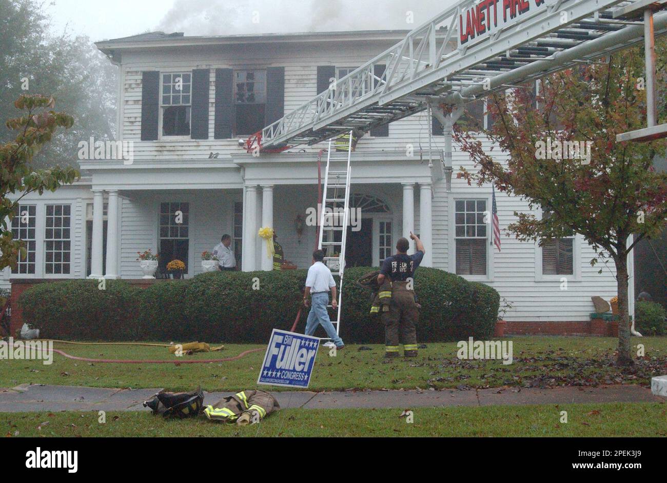 Firefighters are shown at the home of 3rd Congressional District ...