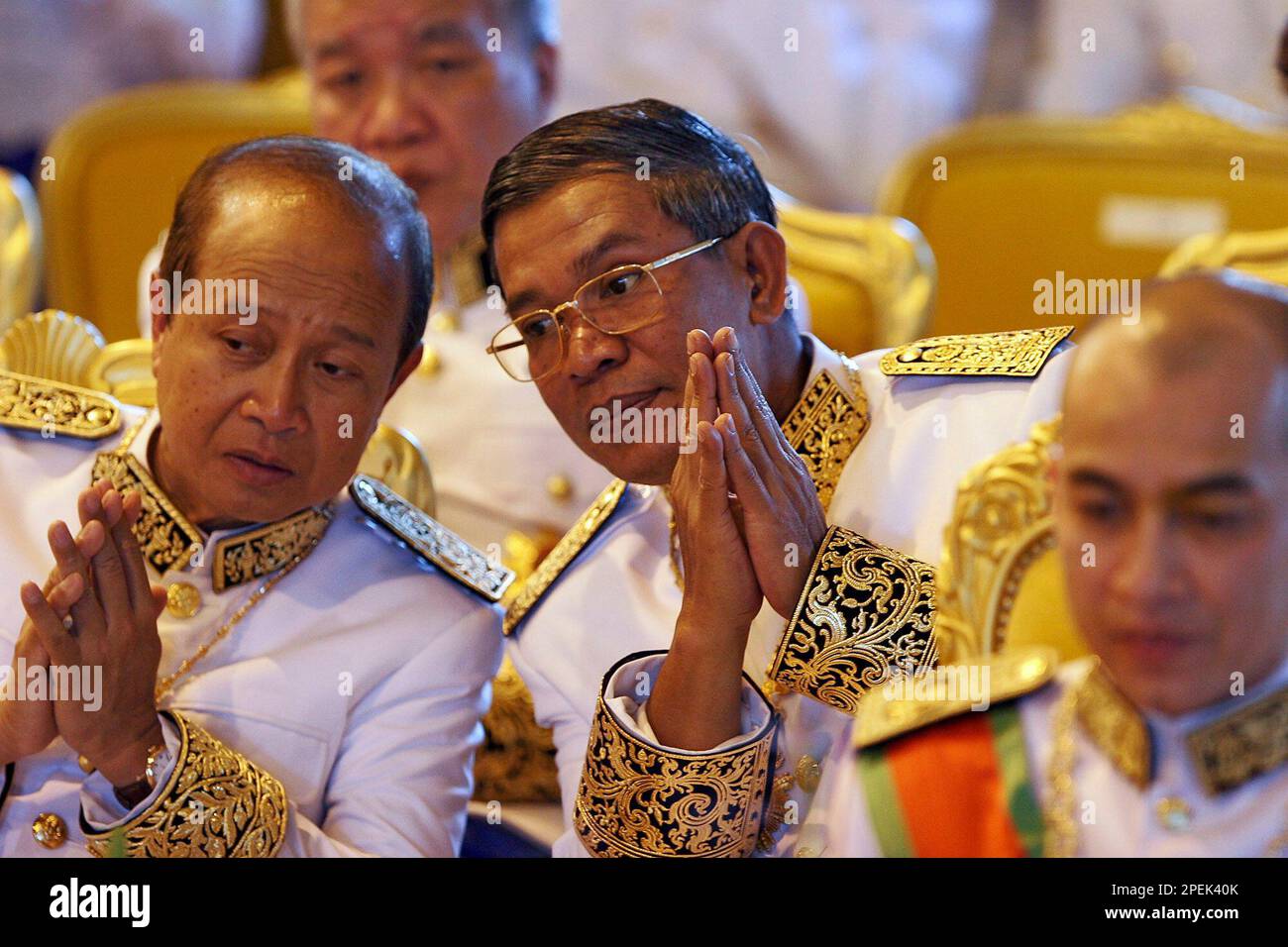 Cambodian Prime Minister Hun Sen, center, chats with opposition leader ...