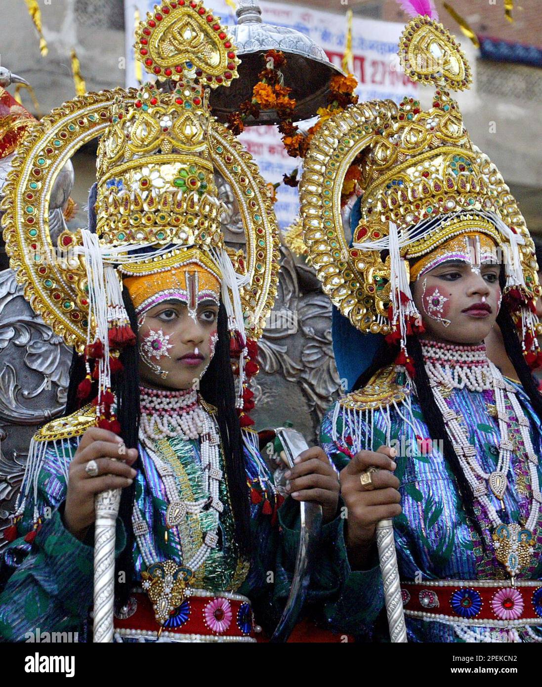 Children stand dressed as Hindu Lord Rama, left, and his brother Laxman ...
