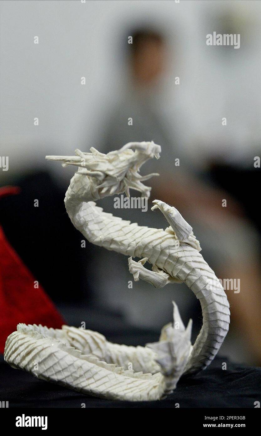 A work of origami, or paper folding, is shown on display during the ...
