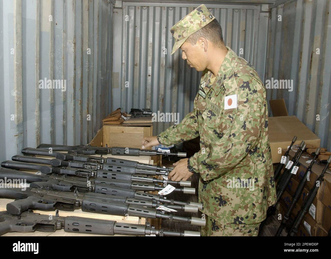 Japanese Army Sgt. Mj. Isao Ikeda, from Okaido, inspects automatic ...