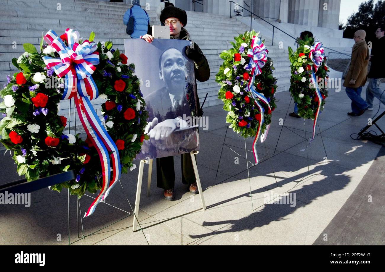 Sonya L. Berger of the National Park Service adjusts a photograph of ...