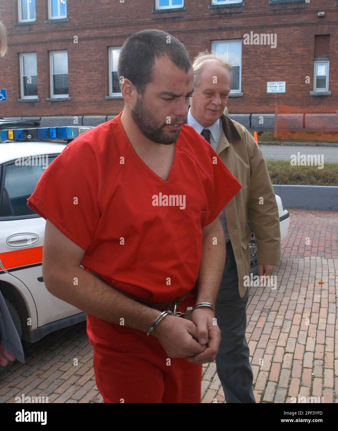 Darcy Petit of Newport, Vt., is led into Vermont District Court by ...