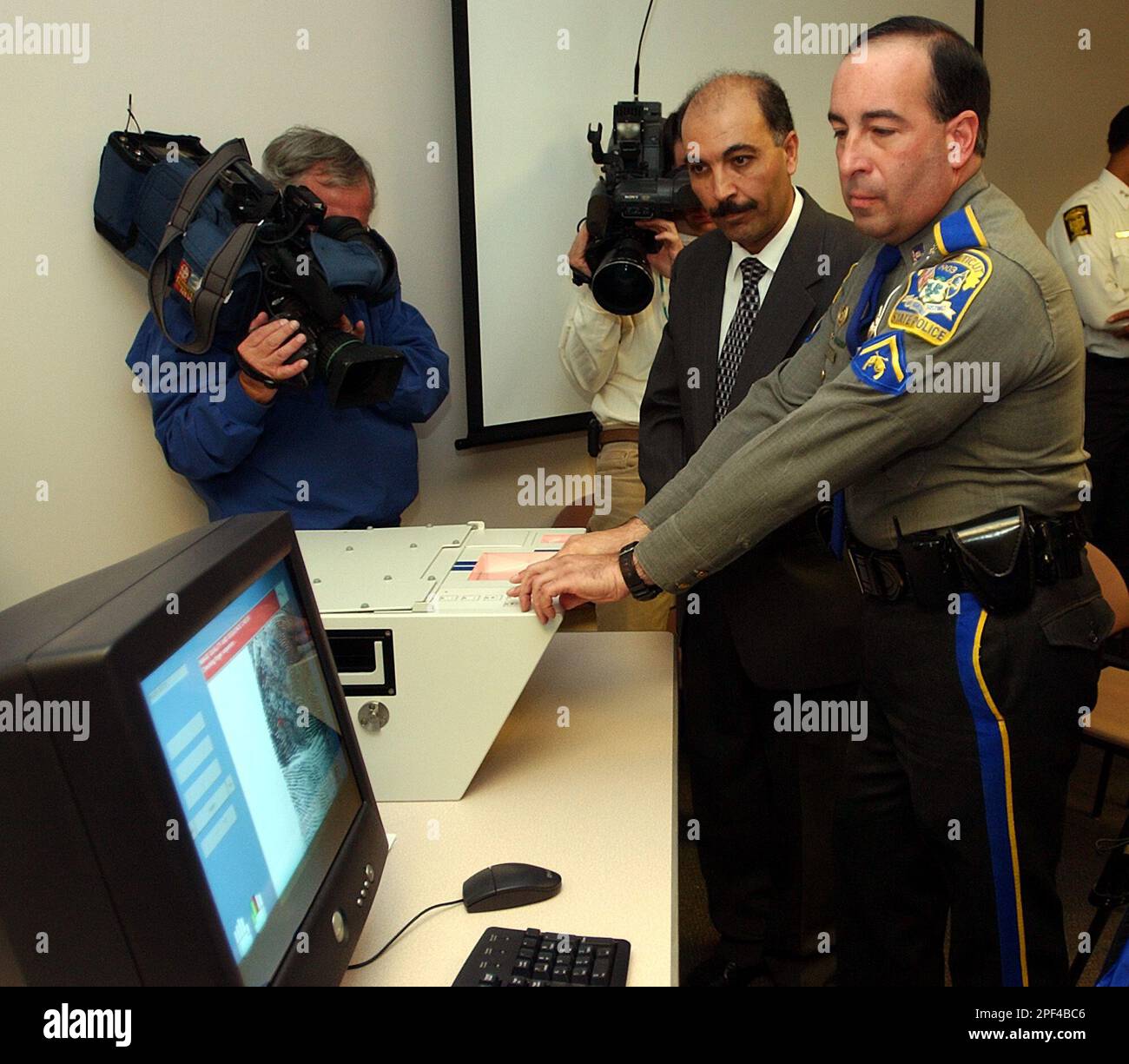Connecticut State Trooper First Class Ben Liberatore, right, and Isam ...