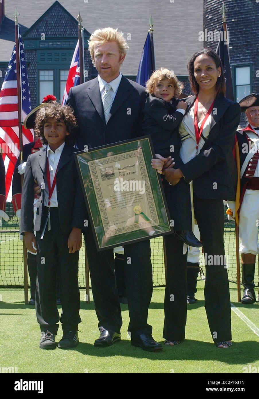 Tennis legend Boris Becker, of Germany, center, poses with his sons ...
