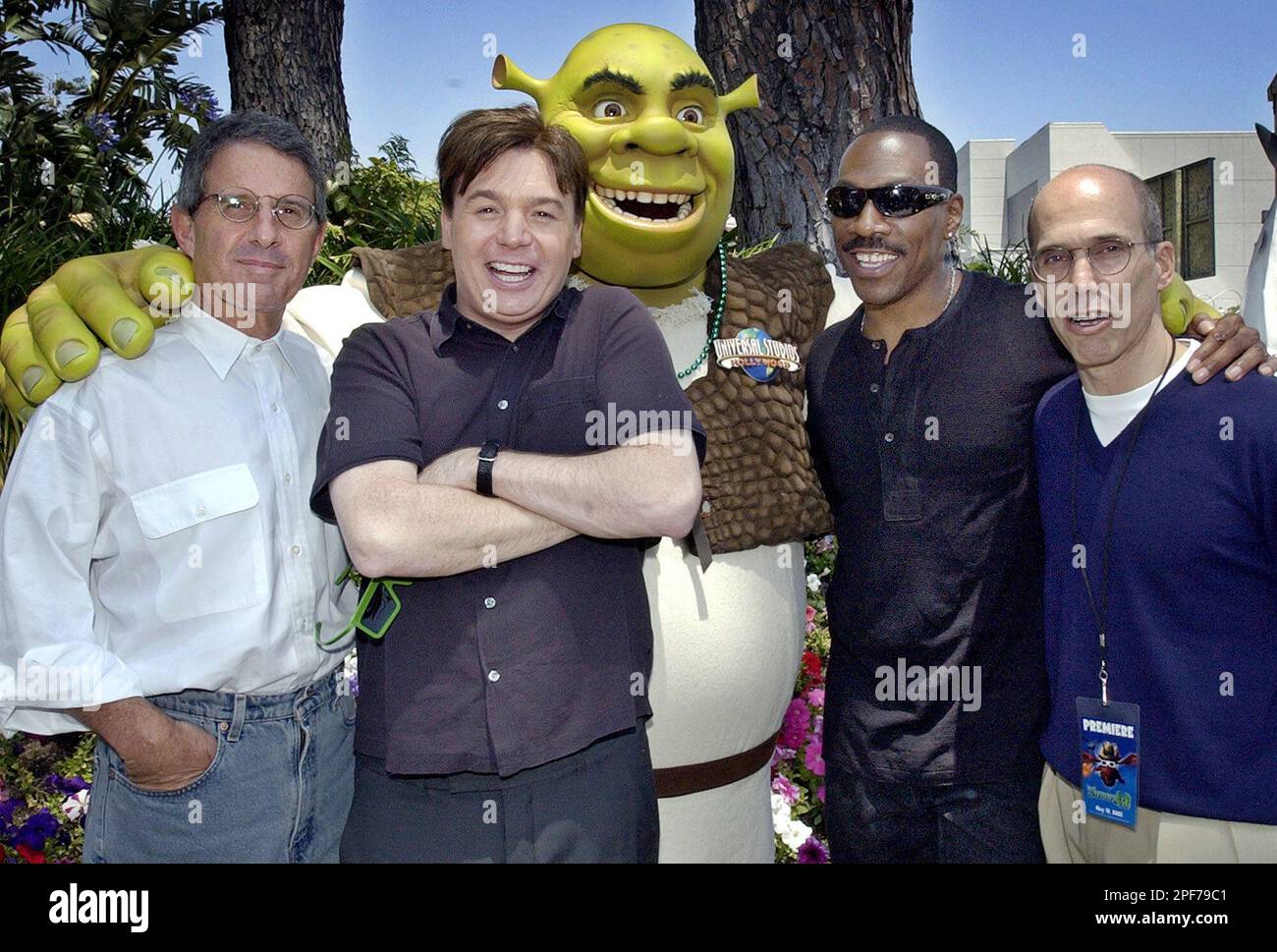 A larger-than-life "Shrek" character poses with key players at the ...