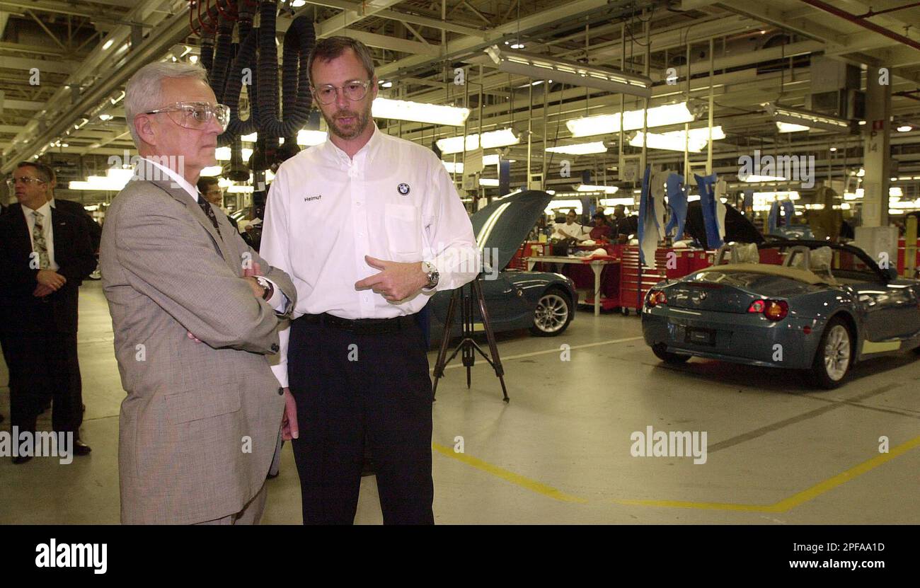 U.S. Treasury Secretary, Paul O'Neill, left, listens to BMW President ...