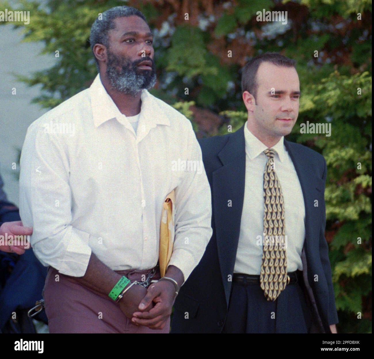 Arthur Bomar, left, is escorted from the Delaware County Courthouse in ...