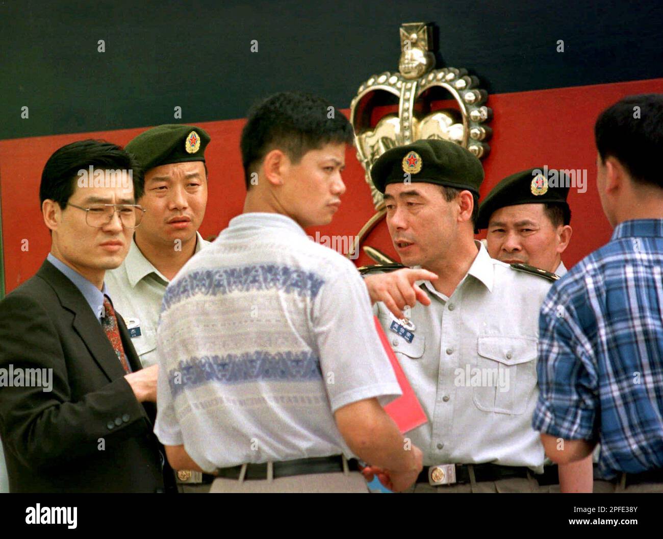 Uniformed and plainclothes members of the People's Liberation Army of ...