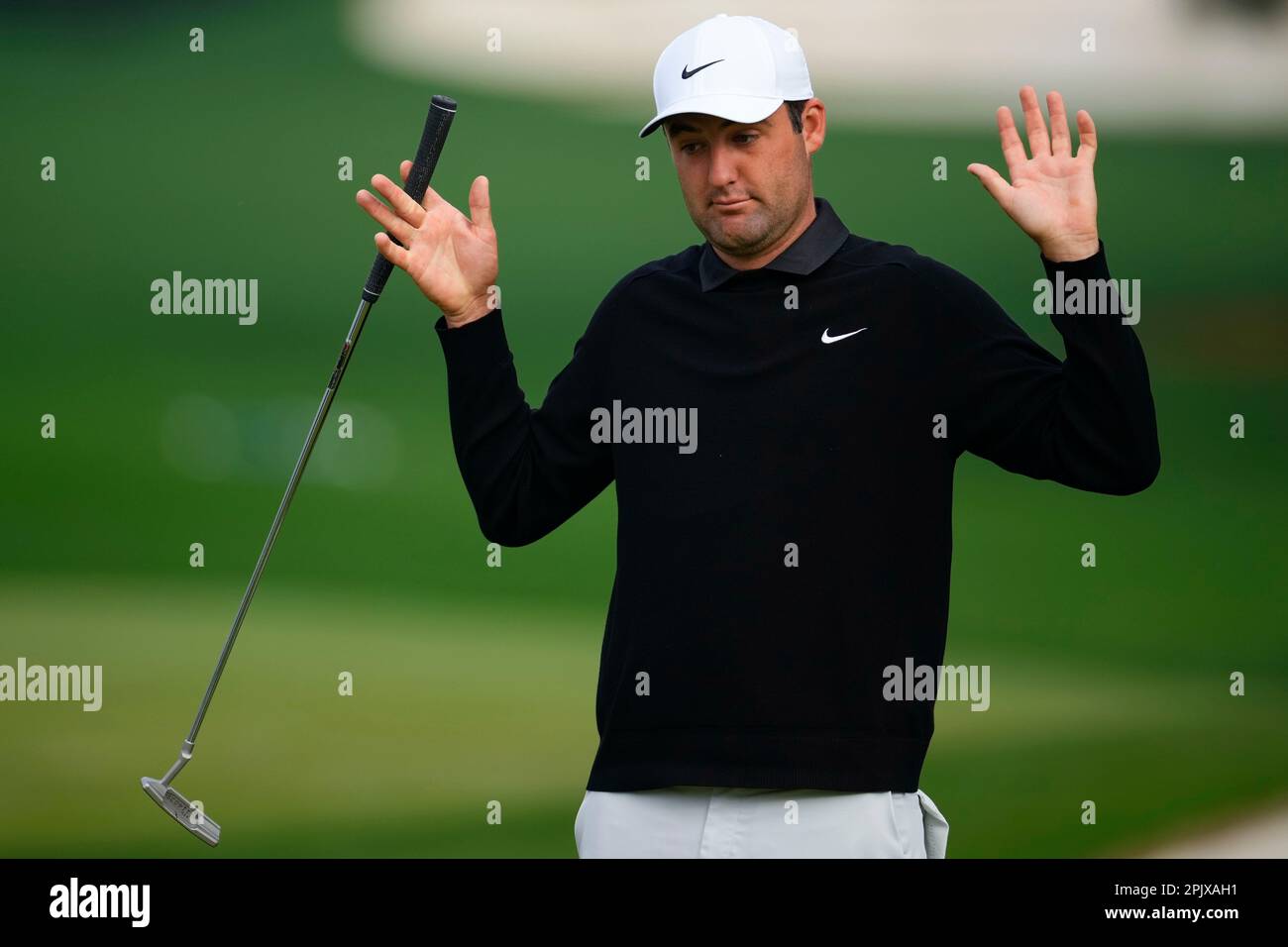Scottie Scheffler works out on the putting green during a practice for ...