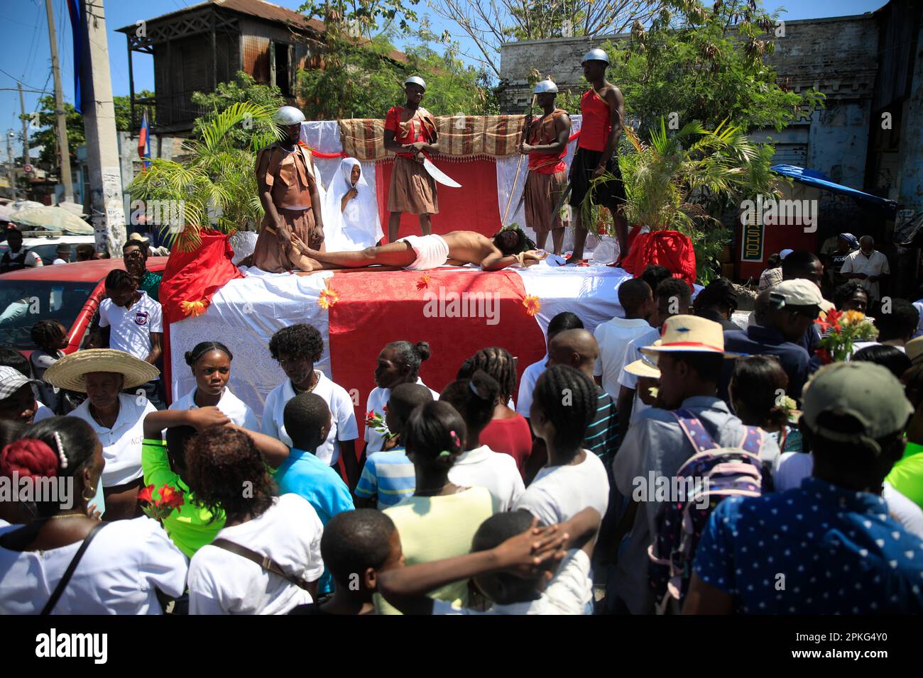 Faithful perform in a Stations of the Cross reenactment, in Port-au ...
