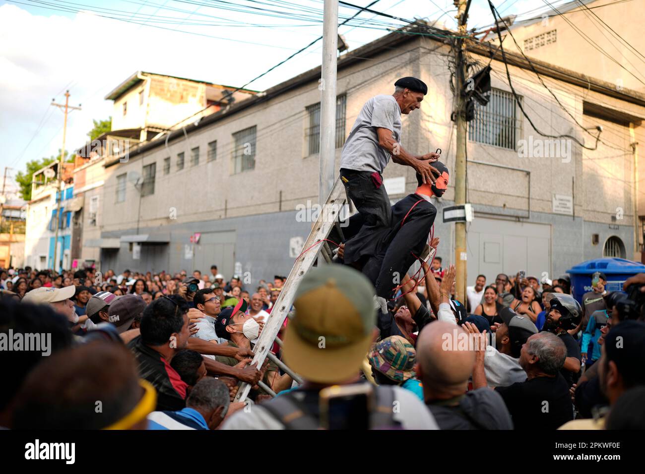 A man tries to balance as he was falling from a ladder while trying to ...