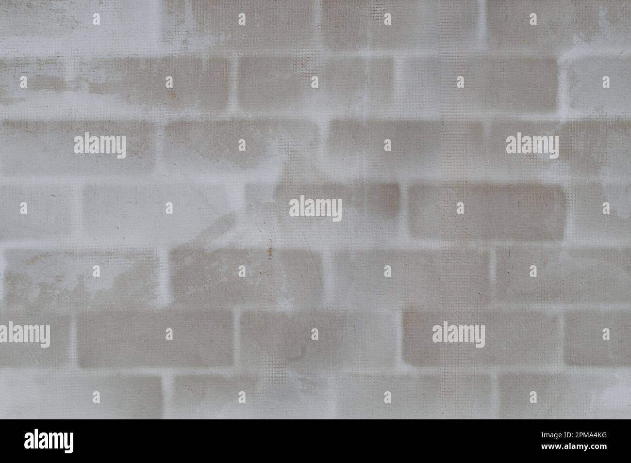 Muro di mattoni fondo con intonaco e rete di rinforzo per intonaco ...