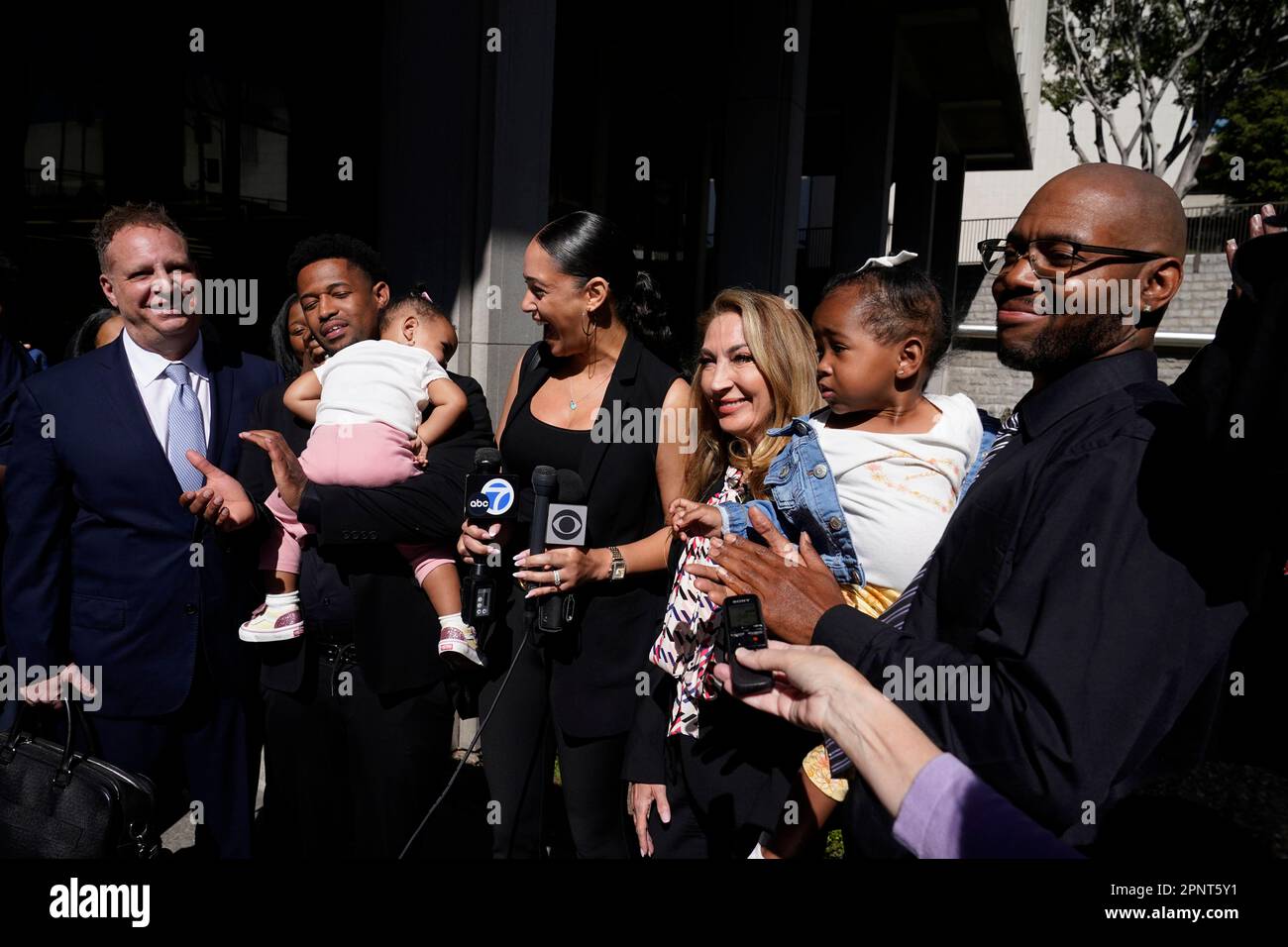Dupree Glass, second from left, holds his daughter Amill and Juan ...