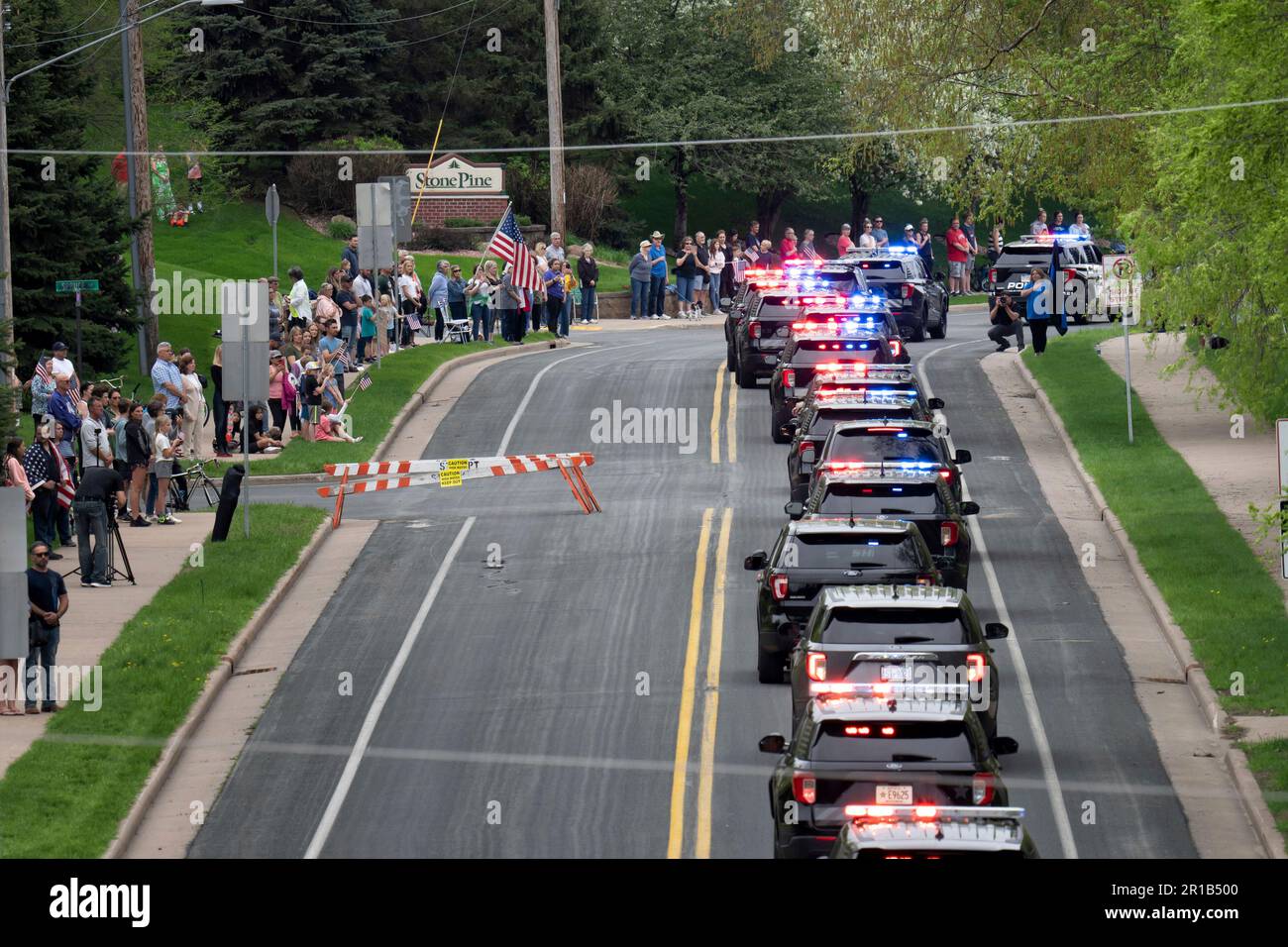 Police vehicles line up during the funeral service for St. Croix County ...