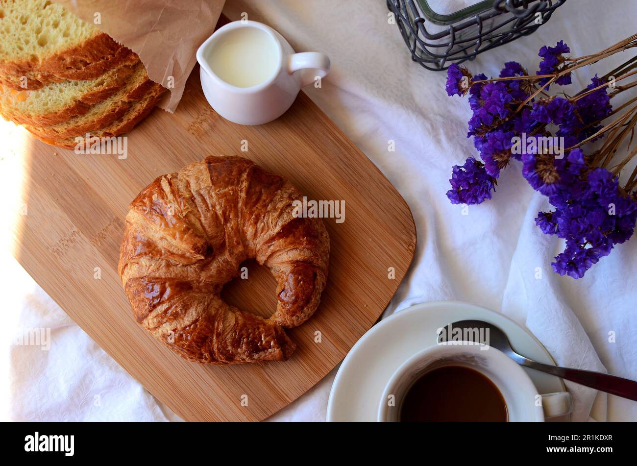 Croissant flowers wooden table immagini e fotografie stock ad alta ...