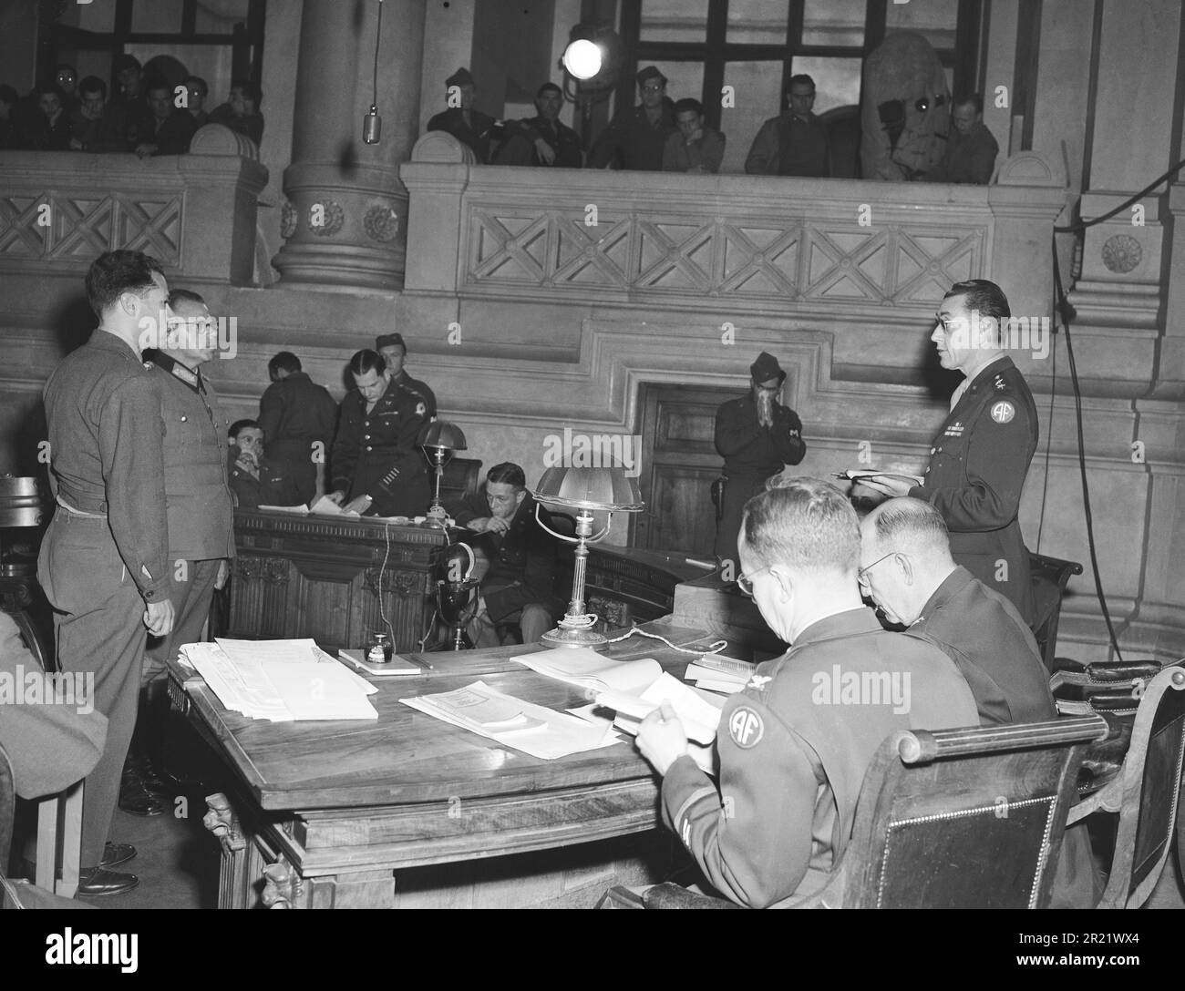 German General Anton Dostler, standing second from left, listens to Maj ...