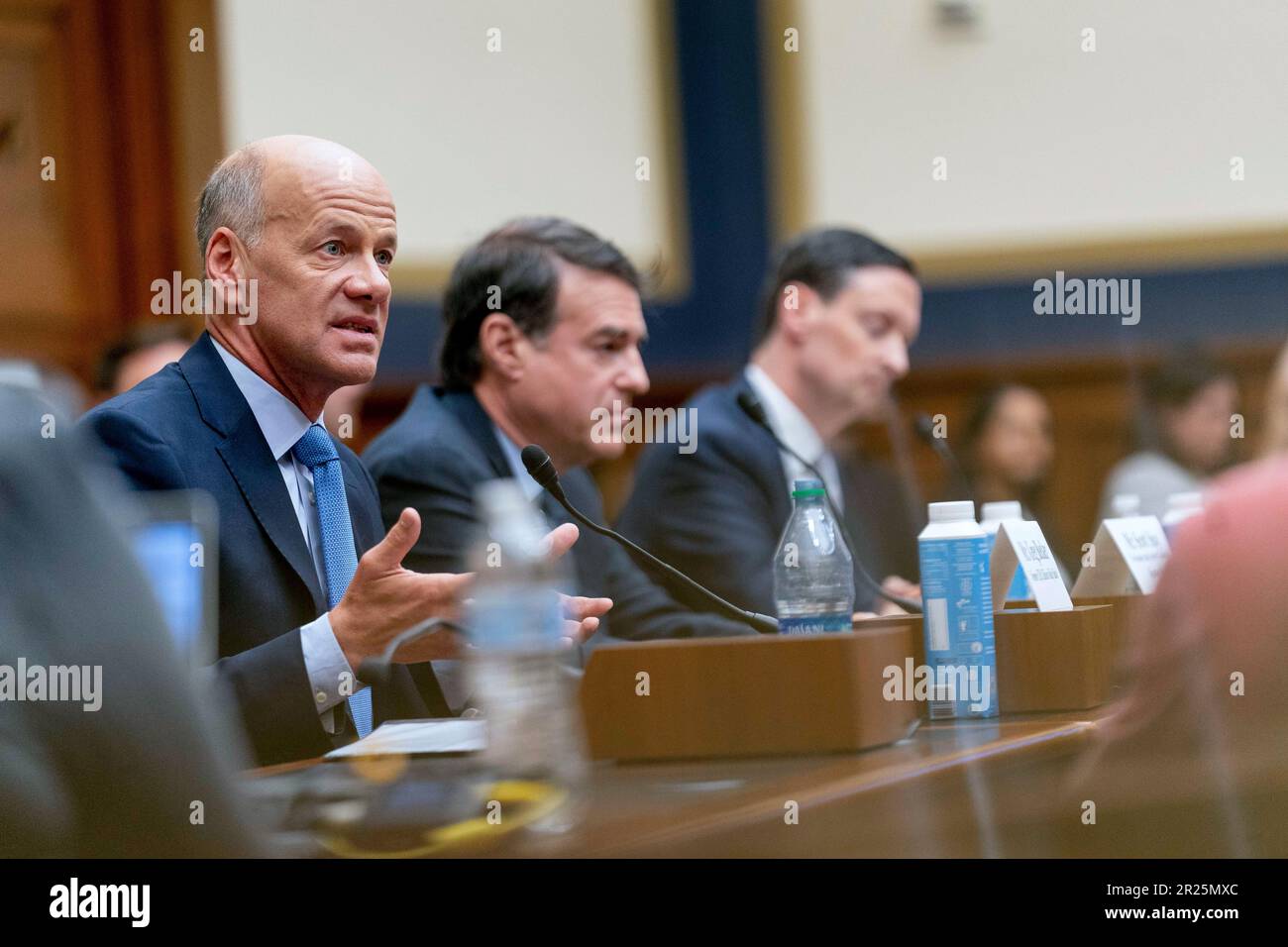 Former Silicon Valley Bank CEO Greg Becker, left, accompanied by ...
