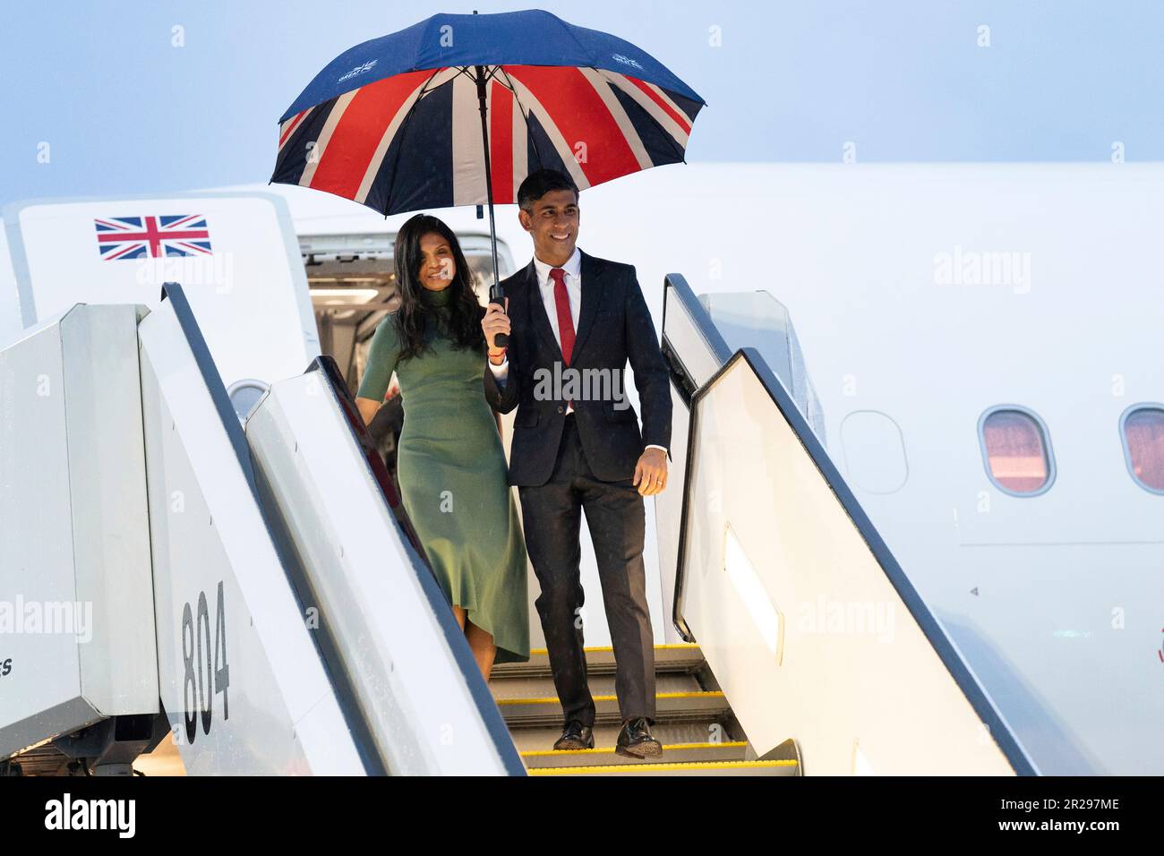 Britain's Prime Minister Rishi Sunak, right, and his wife Akshata Murty arrive by plane in ...