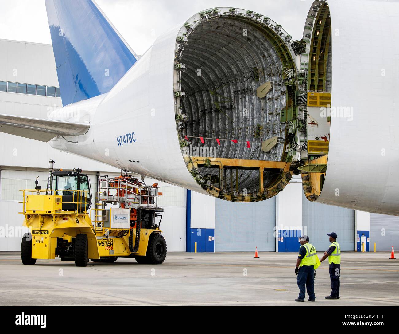 Boeing employees open the tail of a Boeing Dreamlifter on their campus ...