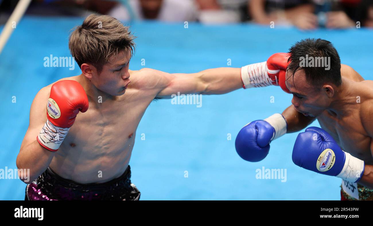 Hayato Tsutsumi of Japan (L) punches Joe Santisima of Philippines ...