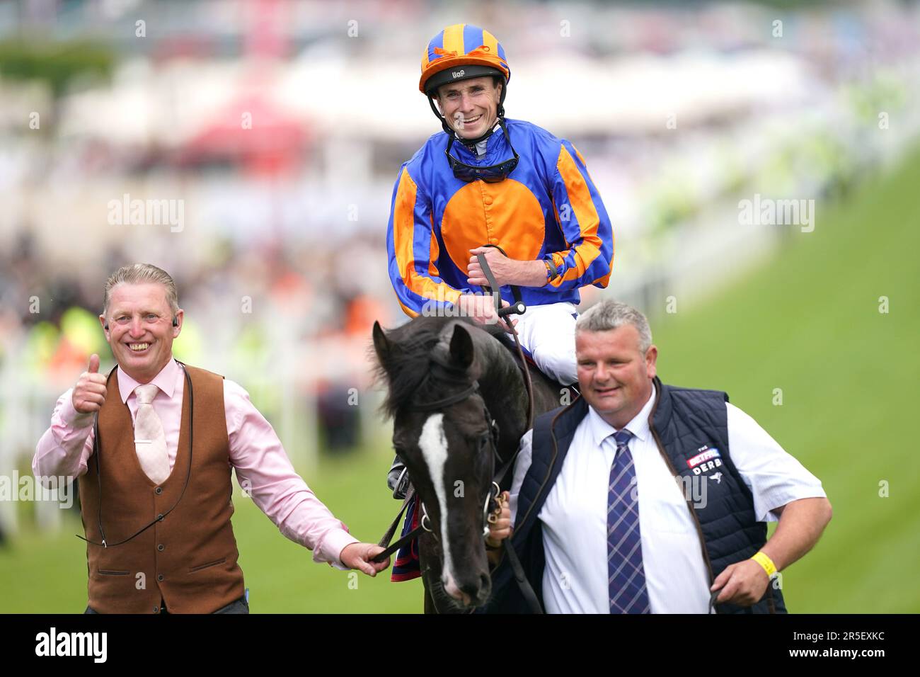 Il jockey Ryan Moore festeggia dopo aver vinto il Betfred Derby con il ...