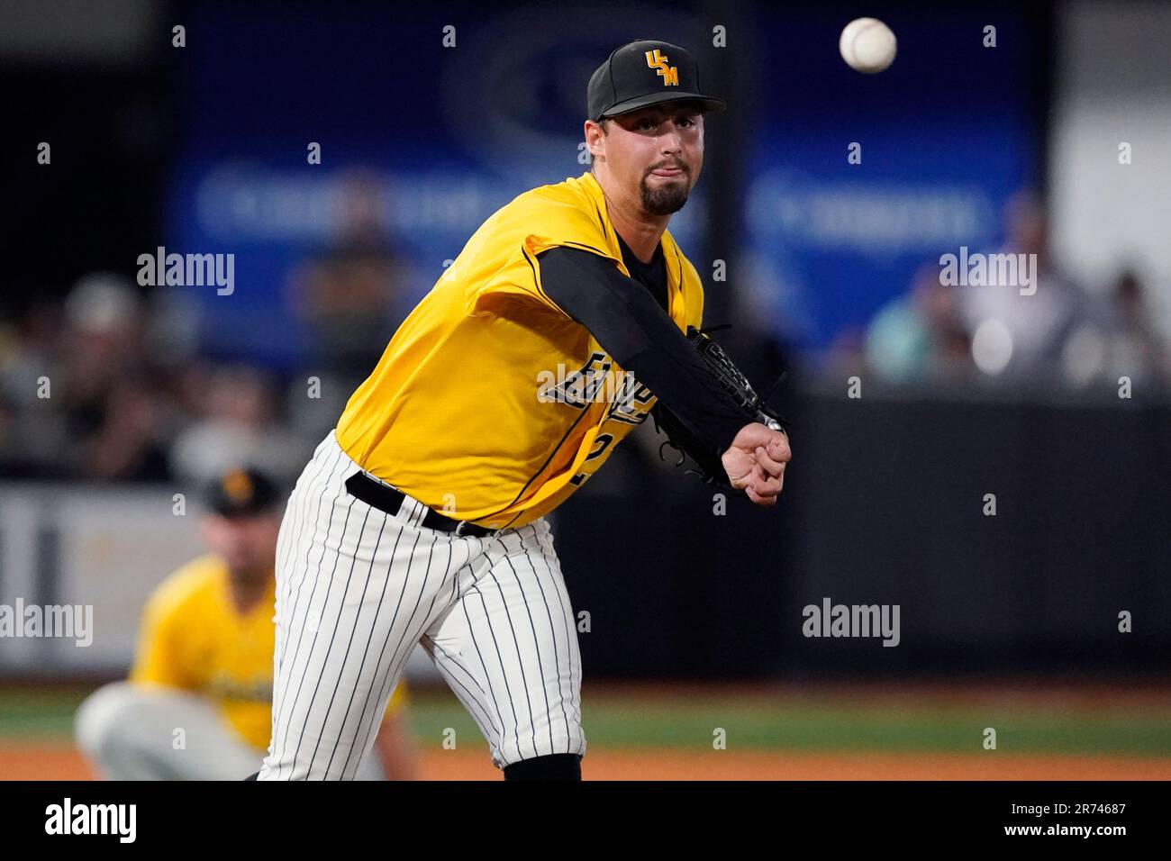 Southern Mississippi pitcher Niko Mazza (23) throws back to first base ...