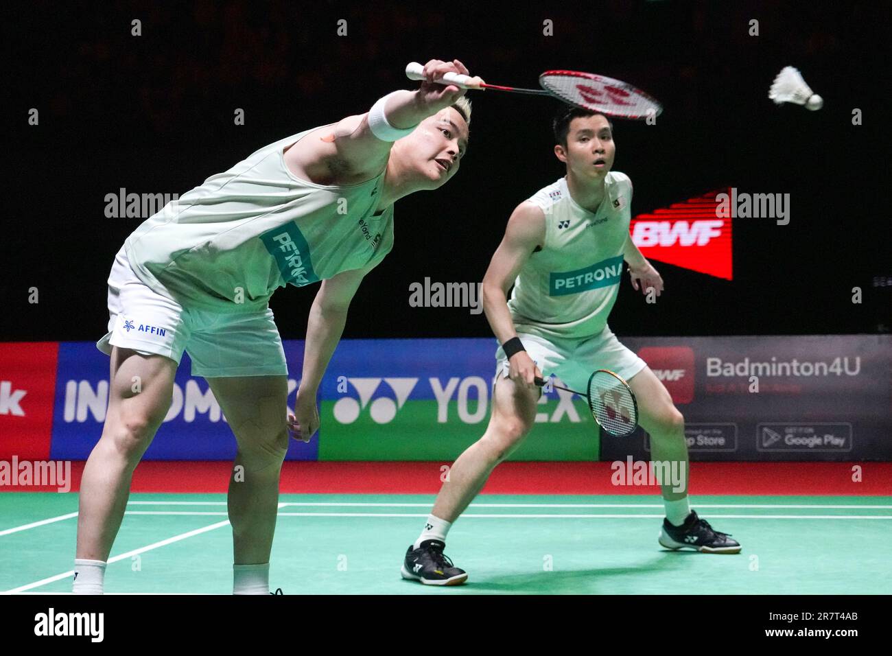 Malaysia's Aaron Chia, left with Soh Wooi Yik play against Indonesia's ...