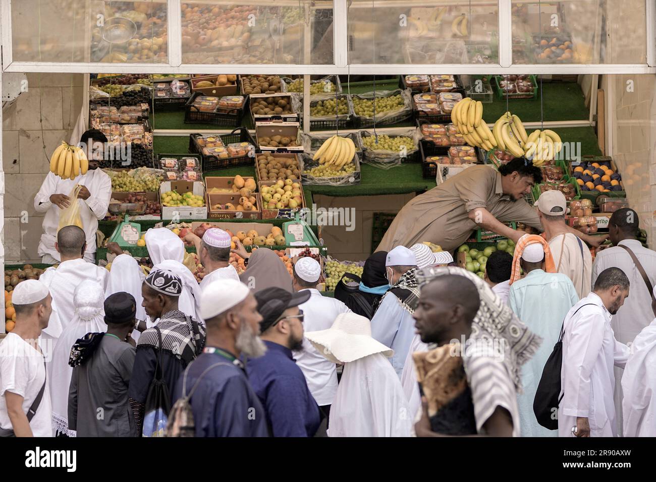 Muslim pilgrims buy fruits outside the Grand Mosque, during the annual ...