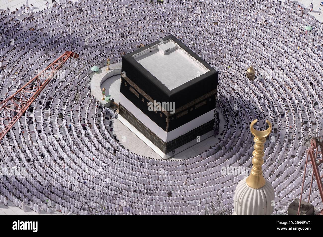 Muslim pilgrims pray around the Kaaba, the cubic building at the Grand ...