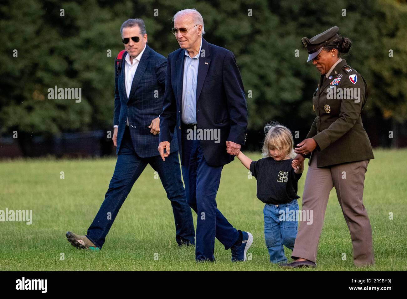 President Joe Biden walks with his grandson Beau Biden, and his son ...