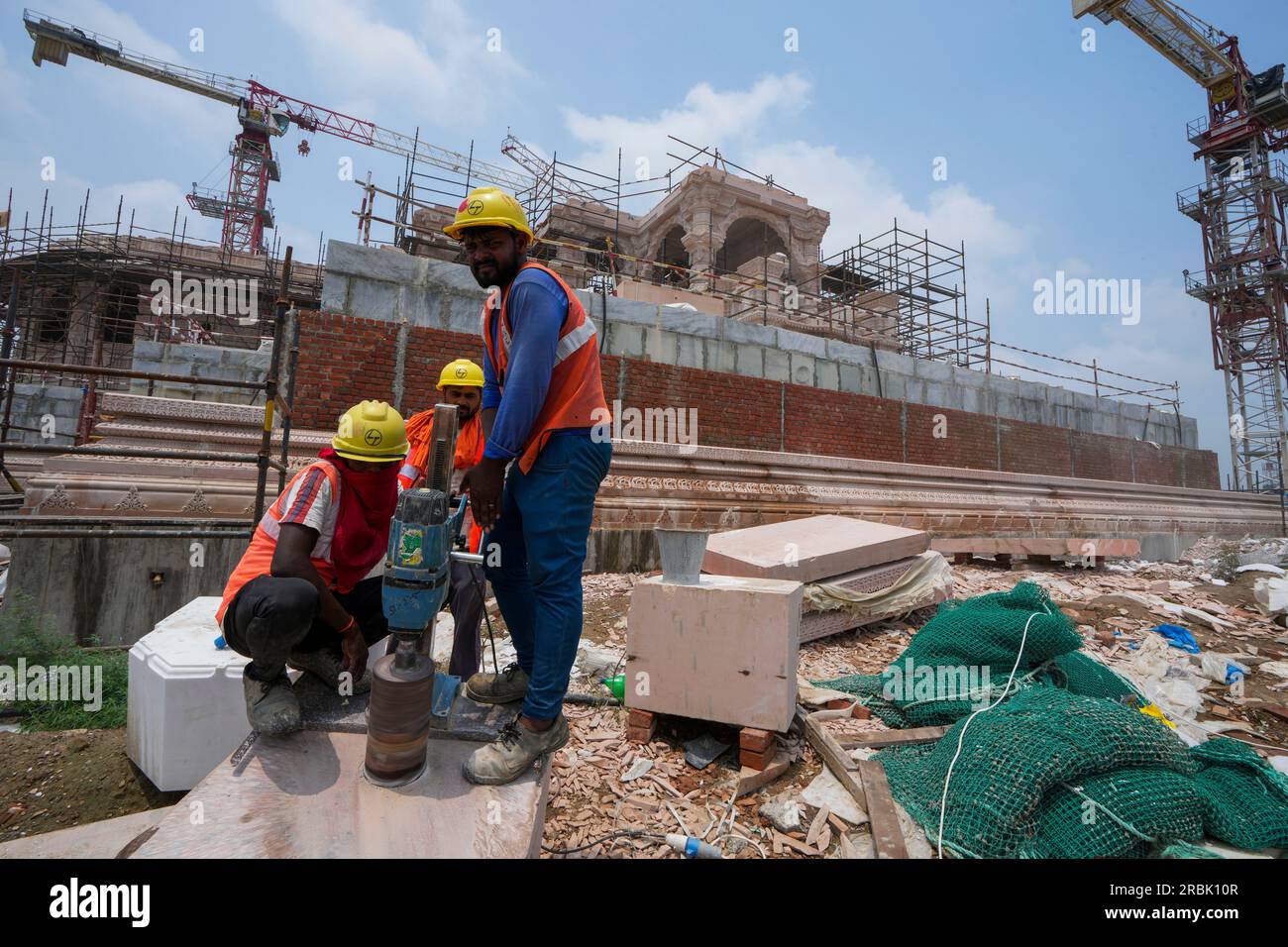 Workers are engaged in the construction of a temple of Hindu god Ram ...