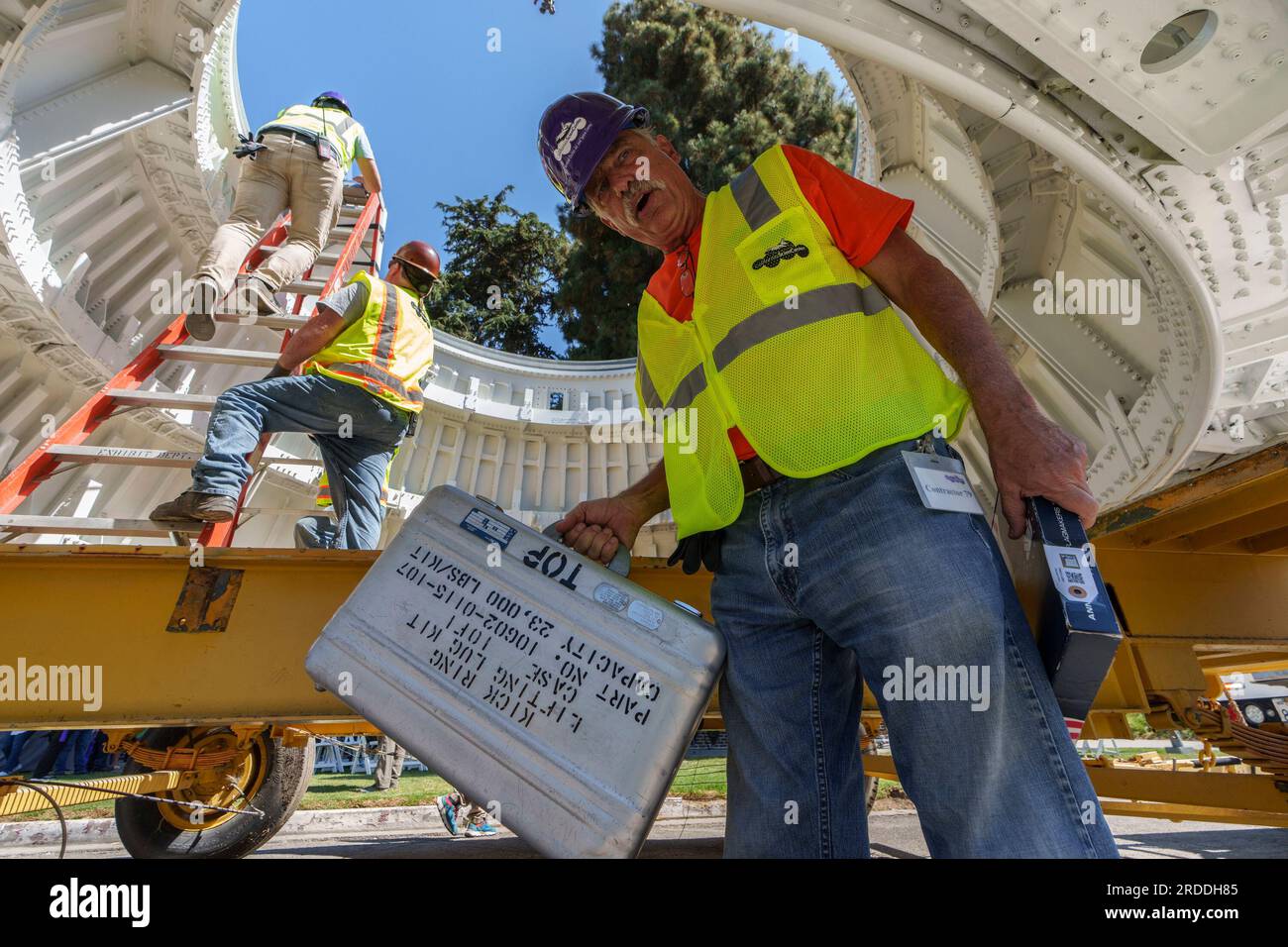 Retired Space Shuttle Rocket Booster engineer Larry Clark holds a ...