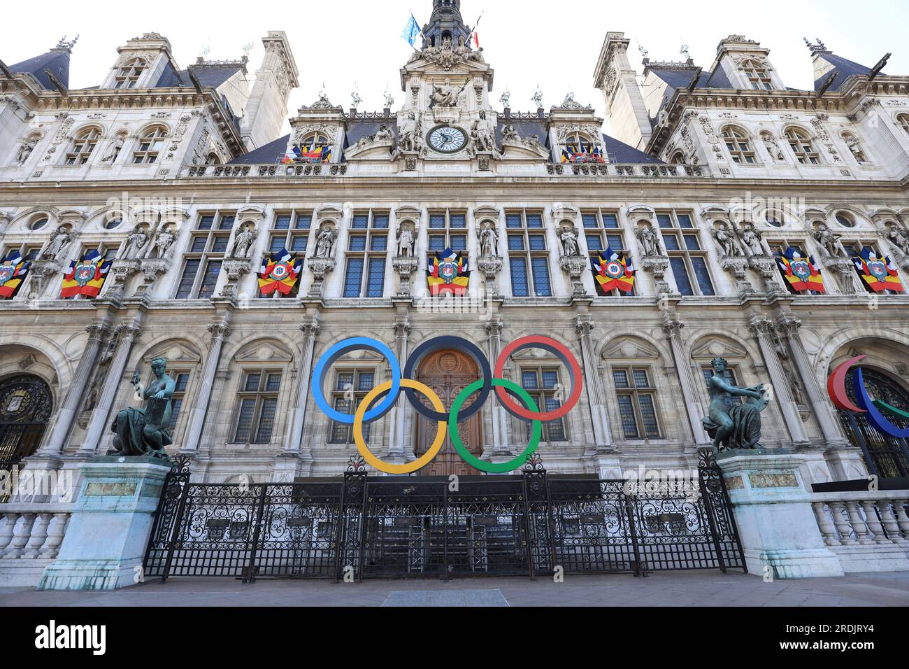 A photo shows the five-ringed Olympic symbol in front of Paris City ...
