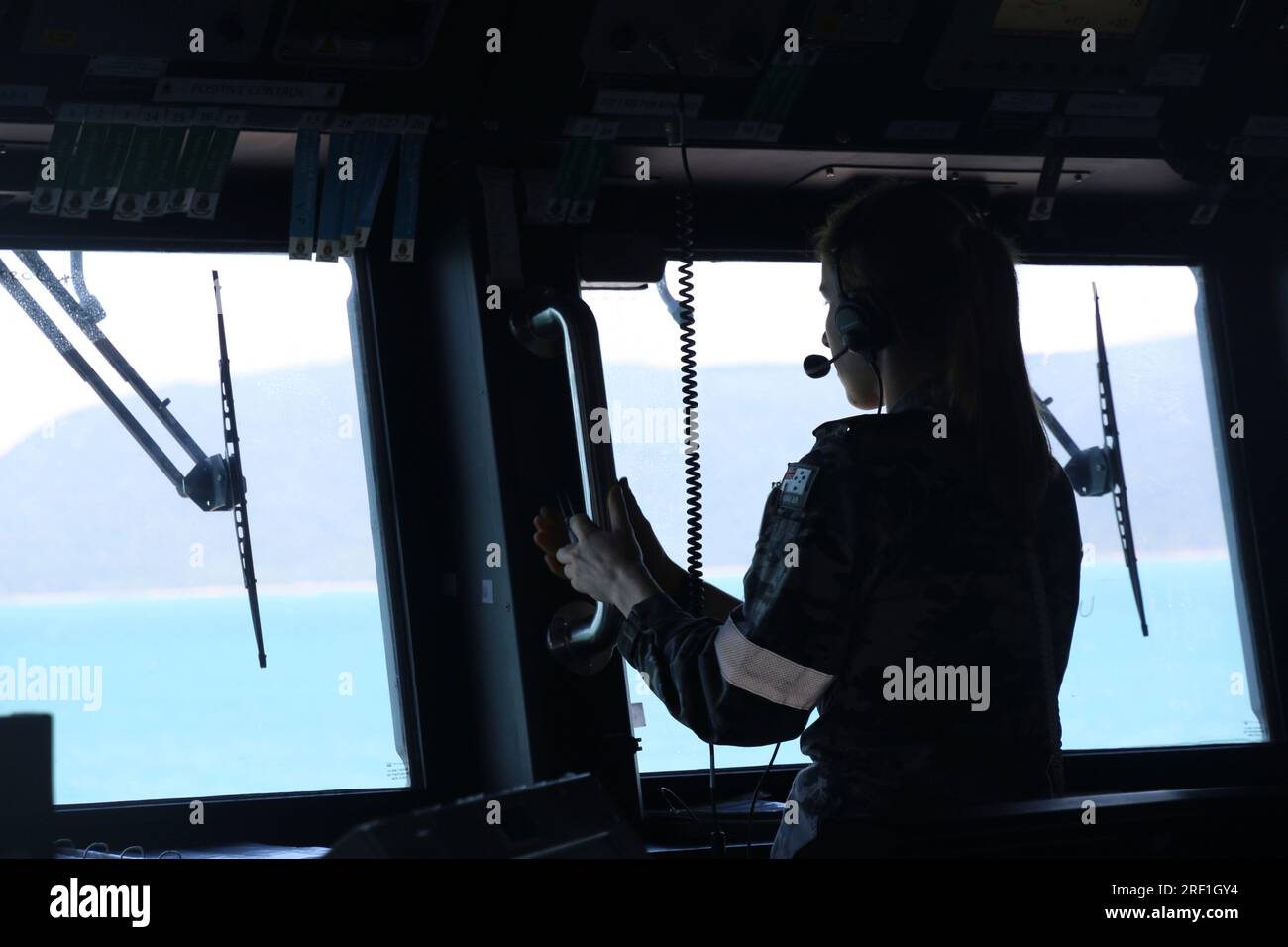 In this photo provided by the Australian Defence Force, a navy sailor ...