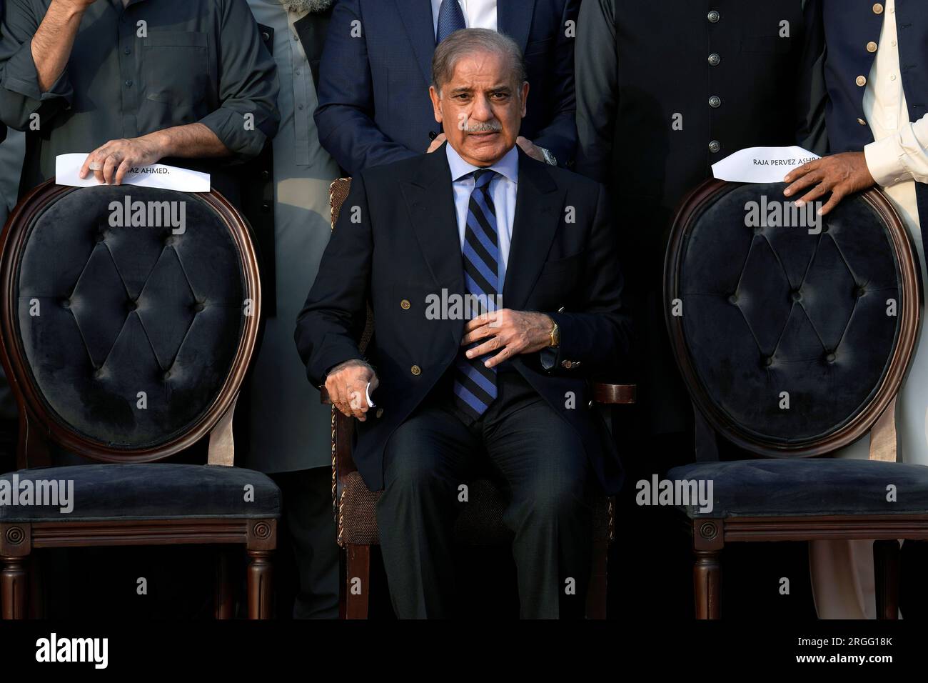Pakistan's Prime Minister Shehbaz Sharif waits for a group photo with ...