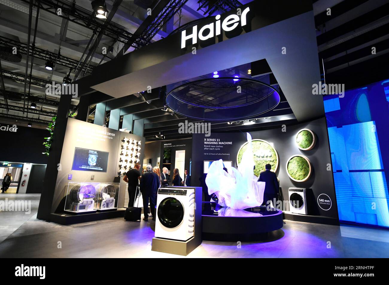 (230901) -- BERLIN, Sept. 1, 2023 (Xinhua) -- People visit the booth of Chinese company Haier ...