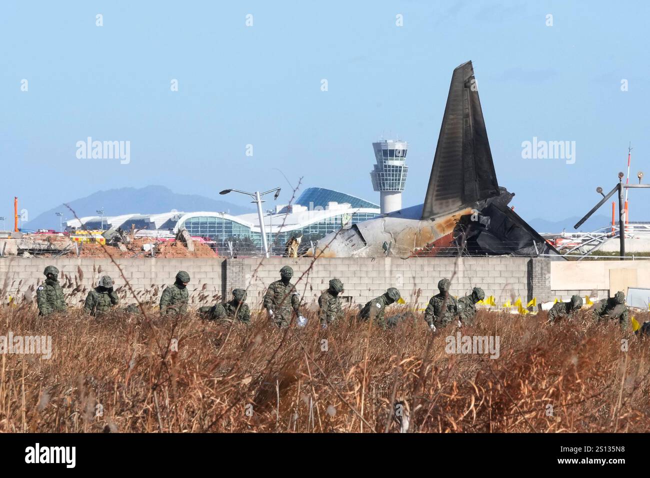 South Korean army soldiers work outside of Muan International Airport in Muan, South Korea ...
