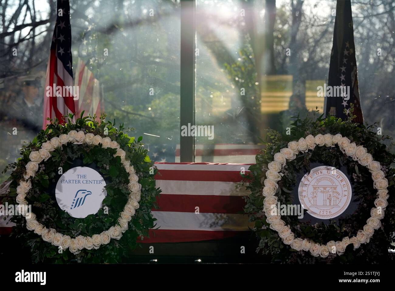 The flag-draped casket of former President Jimmy Carter as he lies in ...