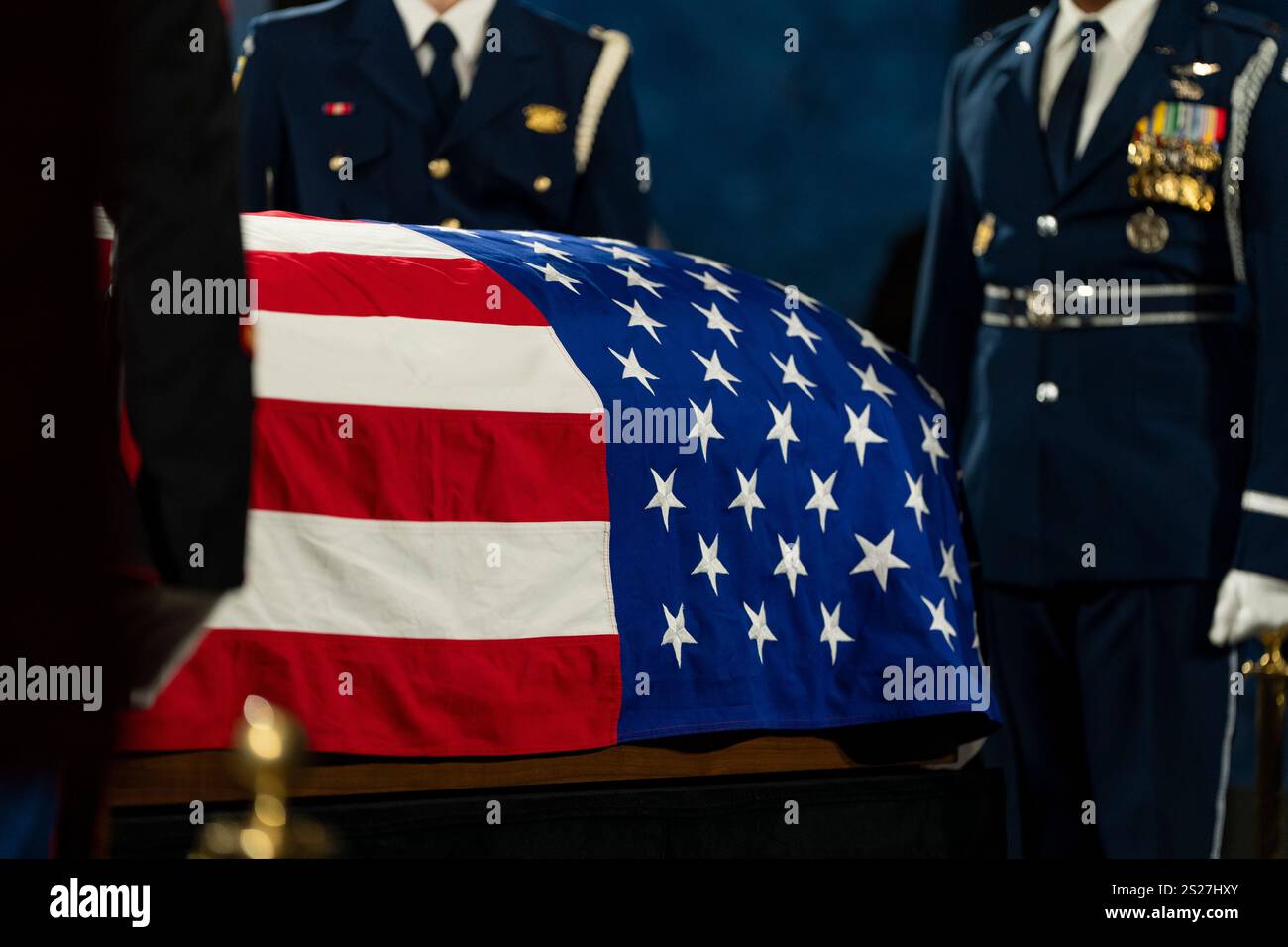 The guard of honor stands as mourners view the casket of former President Jimmy Carter as he ...